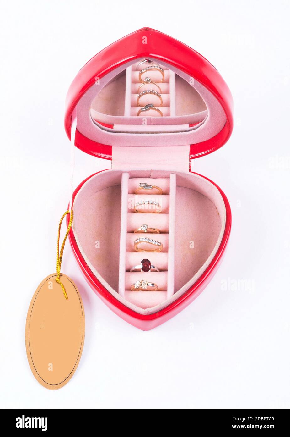 Red gift box in heart shape with rings Stock Photo - Alamy
