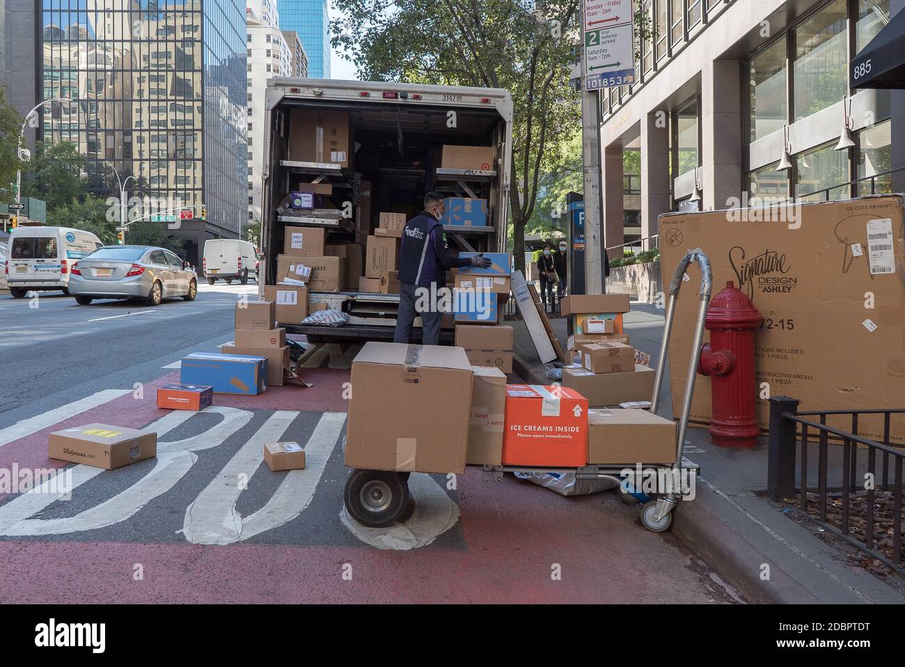 Manhattan, New York. October 08, 2020. A FedEx worker wearing a mask ...