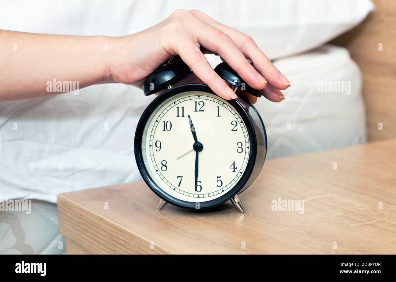 Alarm clock and the woman Stock Photo - Alamy