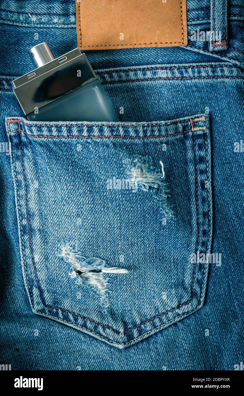 Bottle of perfume on the jeans Stock Photo - Alamy
