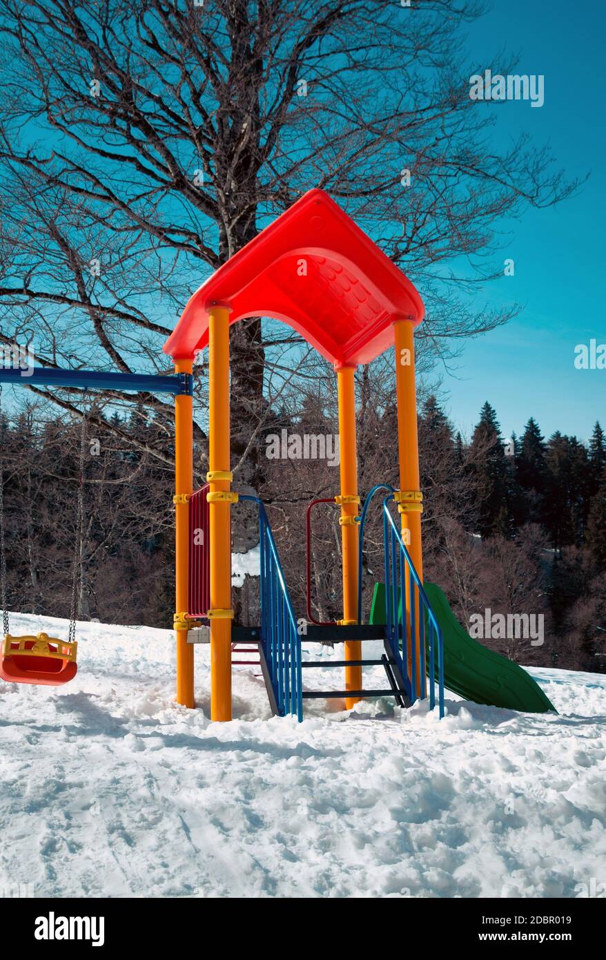 Children playground in the snow Stock Photo - Alamy