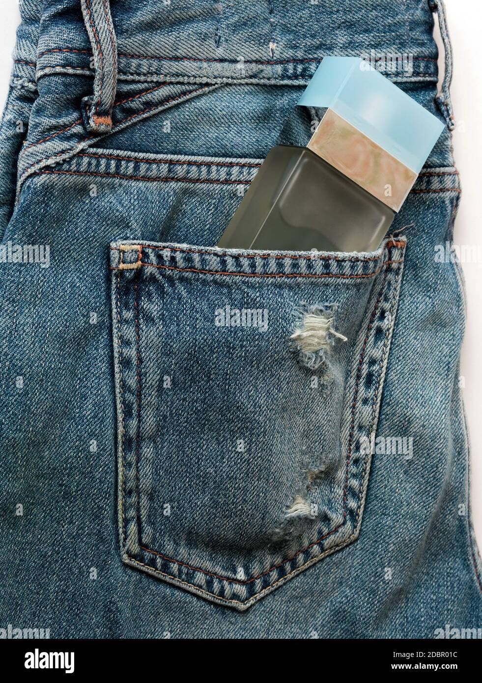 Bottle of perfume in the jeans Stock Photo - Alamy