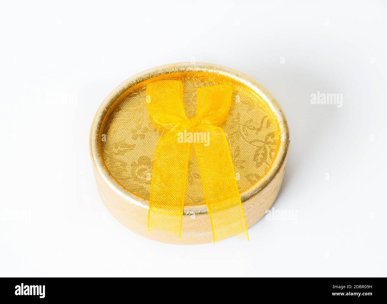 Yellow gift box on white Stock Photo - Alamy
