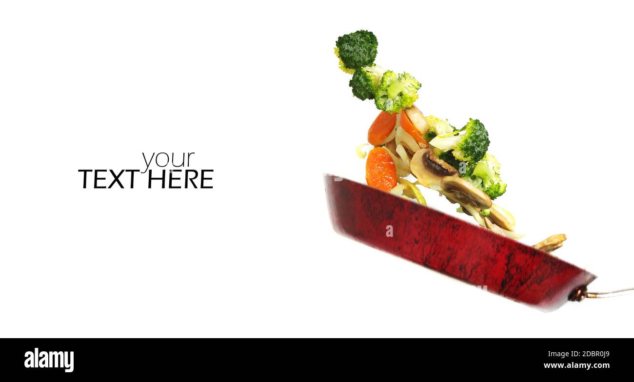 Flying vegetables on pan with copy space Stock Photo - Alamy