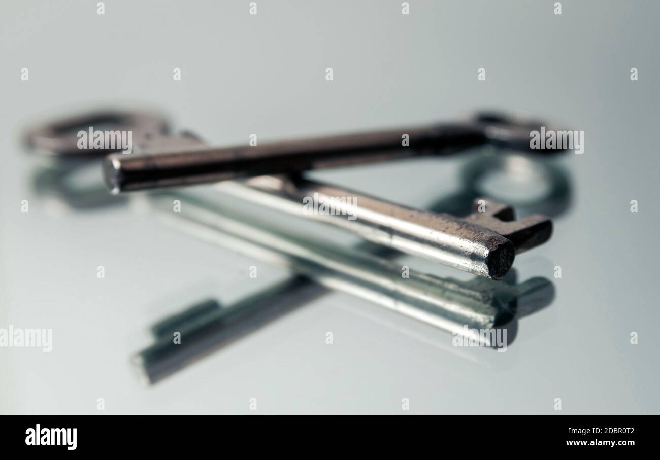 Old iron keys on the table Stock Photo - Alamy