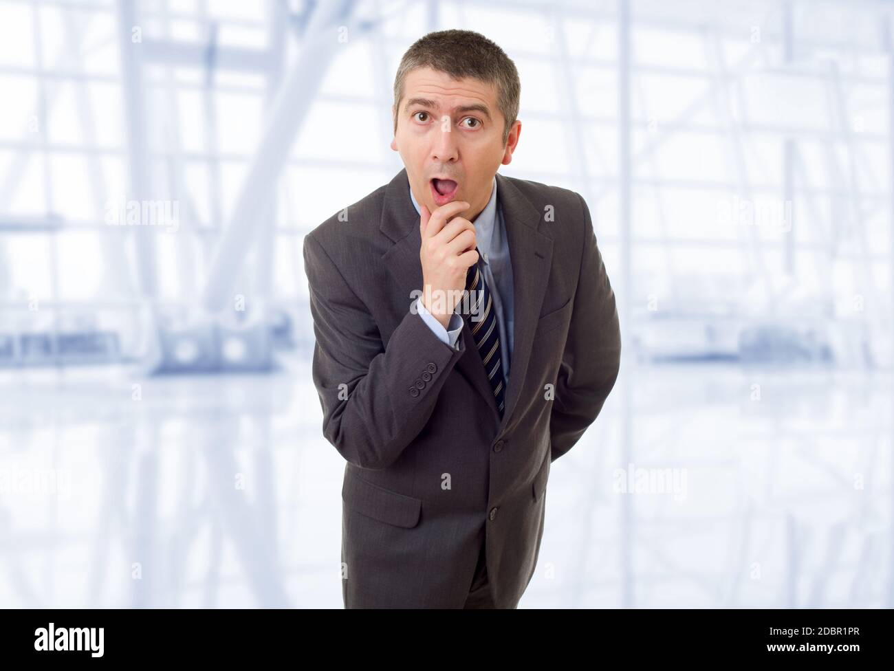 silly business man surprised at the office Stock Photo - Alamy