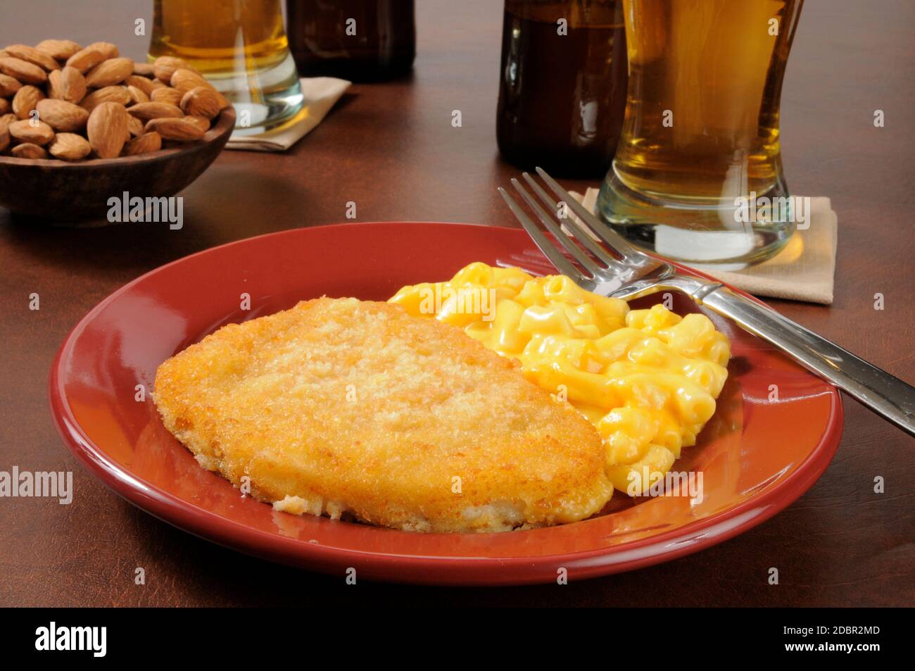 Fish fillets with macaroni and cheese and glasses of beer Stock Photo ...