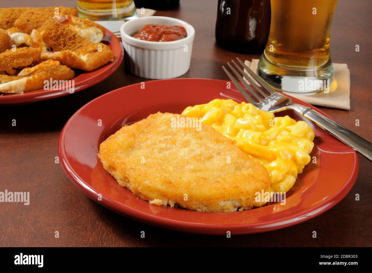 Fish sticks with macaroni and cheese, mozzarella cheese sticks and beer ...