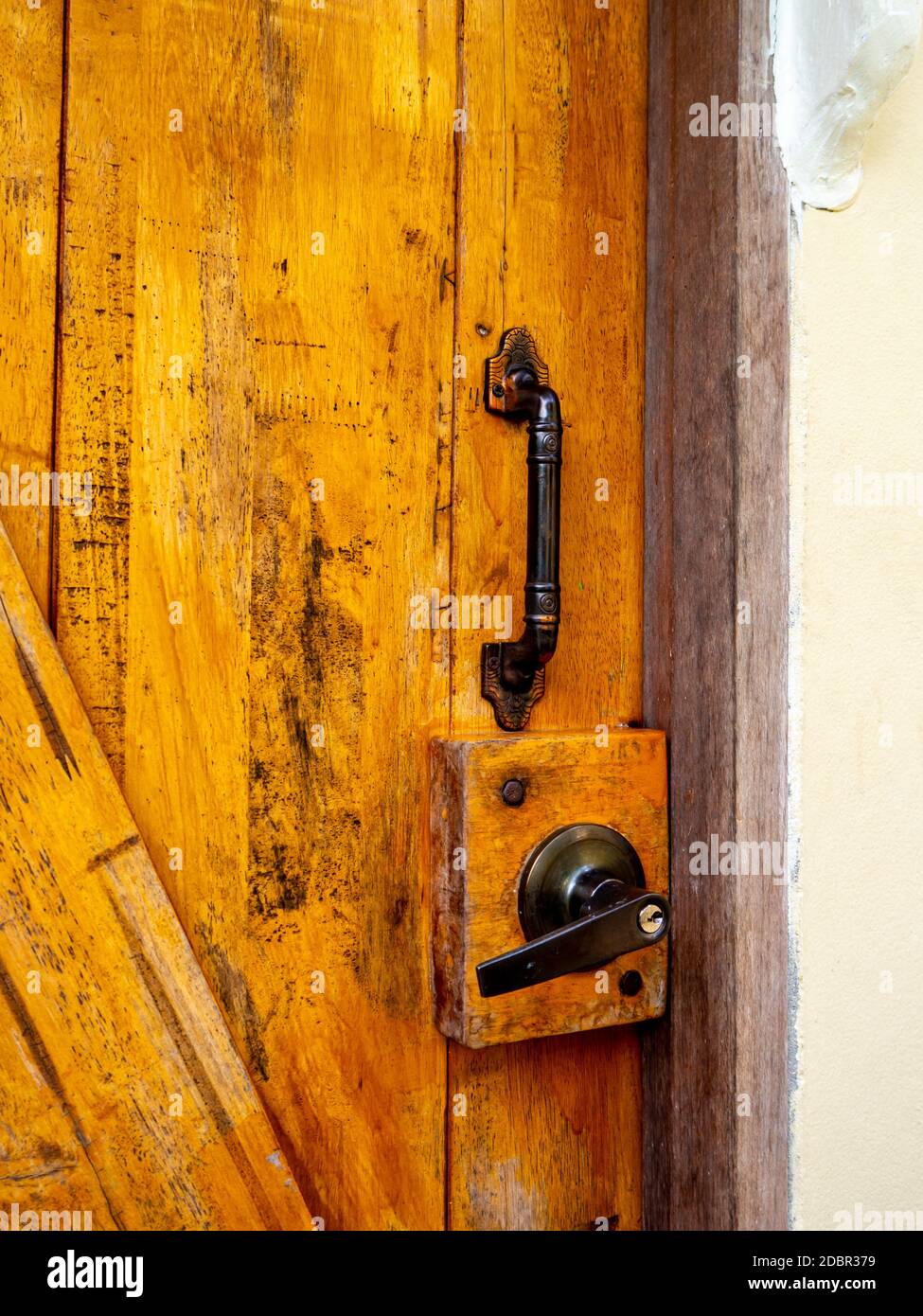 New brown modern wooden door lock in house interior Stock Photo - Alamy