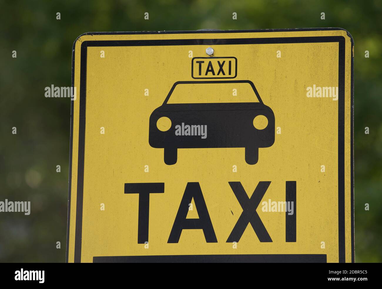 Yellow Taxi sign with the pictogram of a car Stock Photo - Alamy
