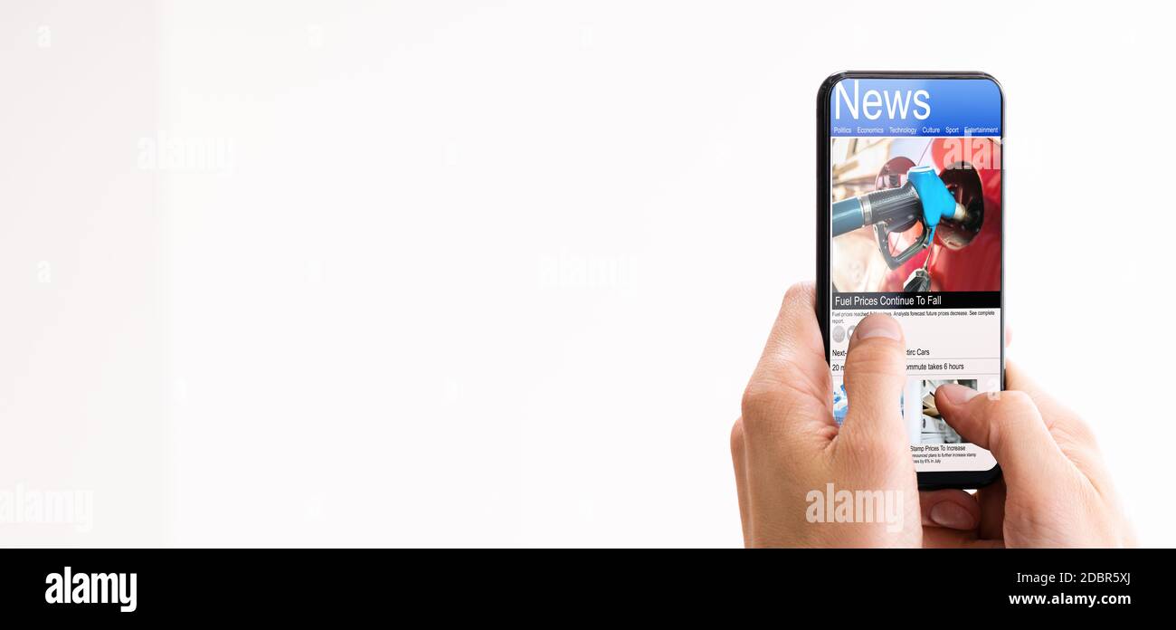 Reading Newspaper Article Online On Mobile Phone Stock Photo - Alamy