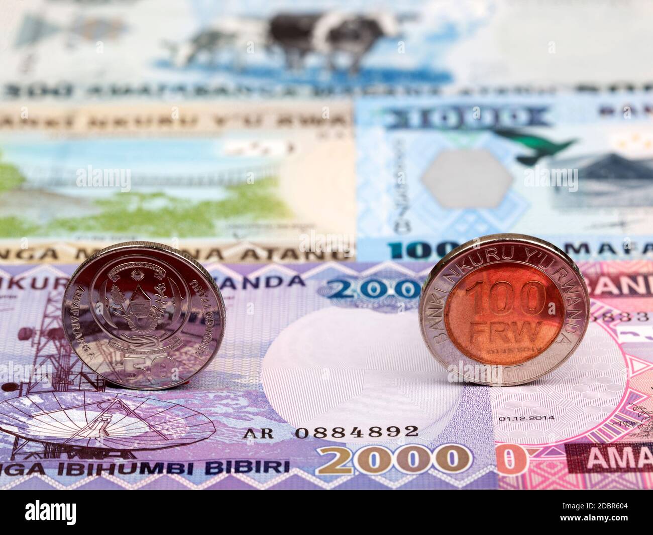 Rwandan coins on the background of money Stock Photo - Alamy