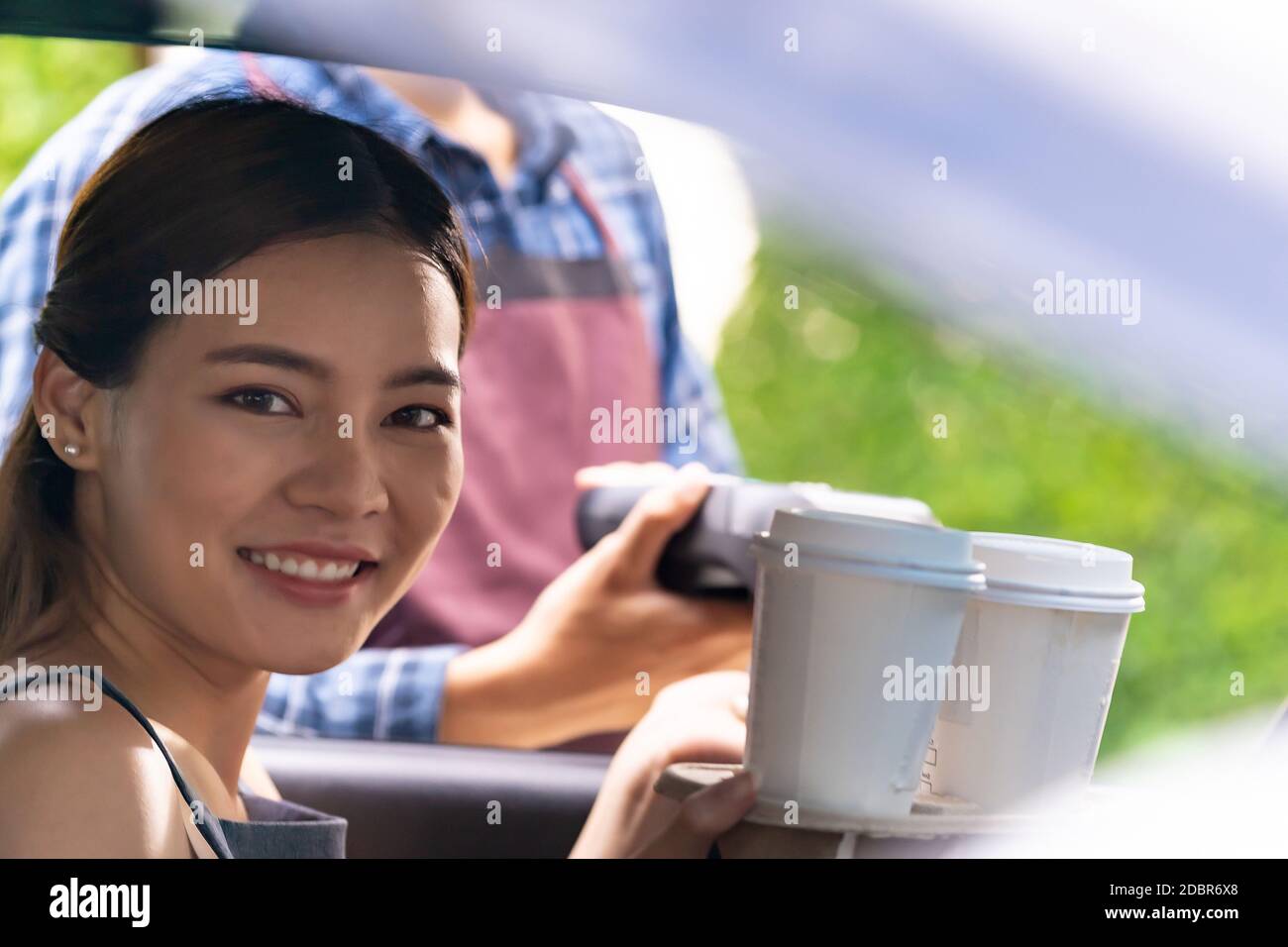 Asian woman customer make mobile payment contactless technology to ...