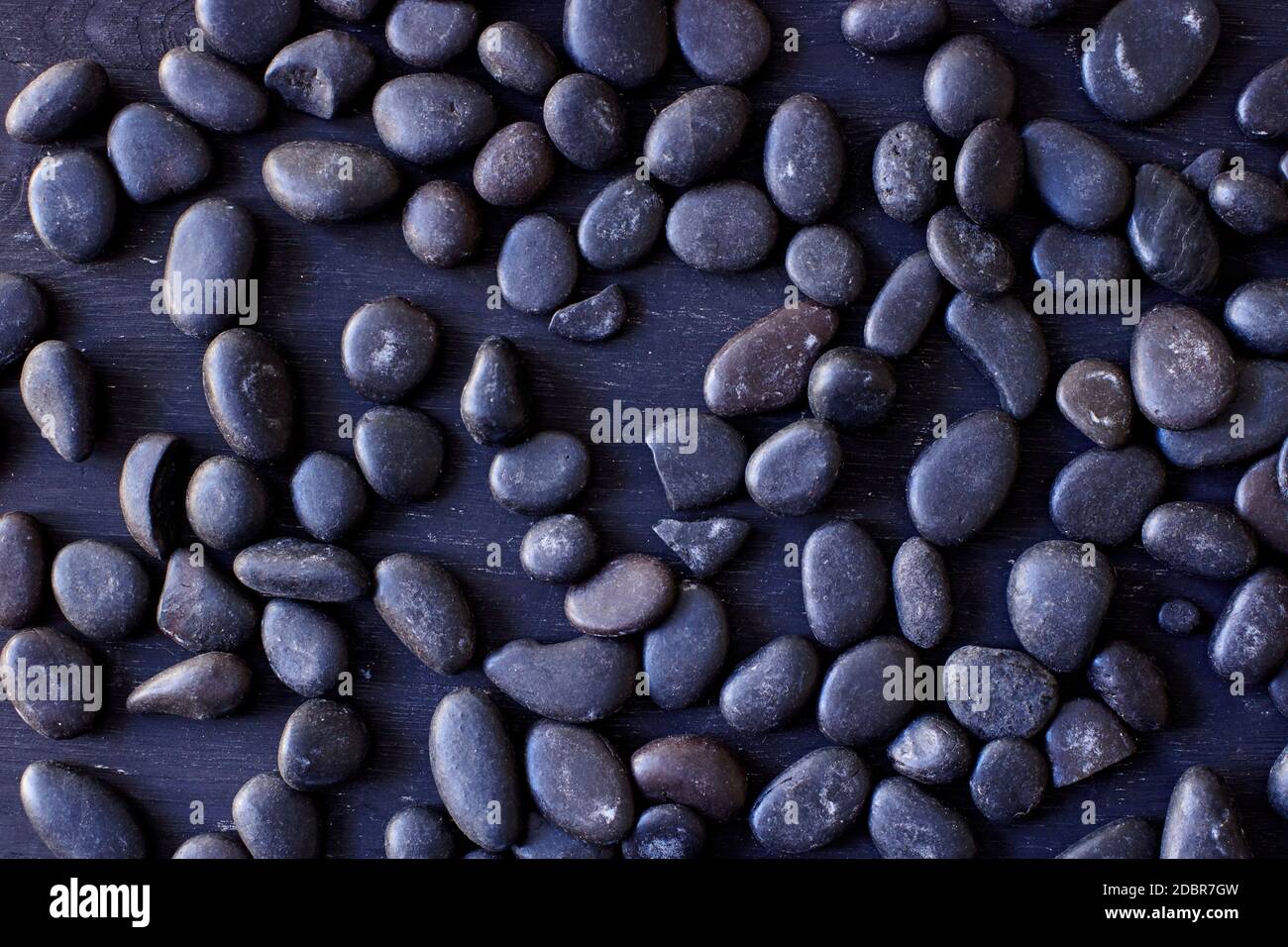 A studio photo of black river rocks Stock Photo - Alamy