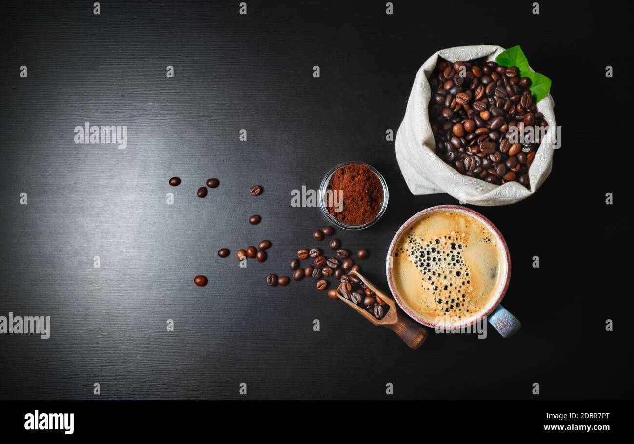 Brewing coffee background. Coffee cup, ground powder and coffee beans ...