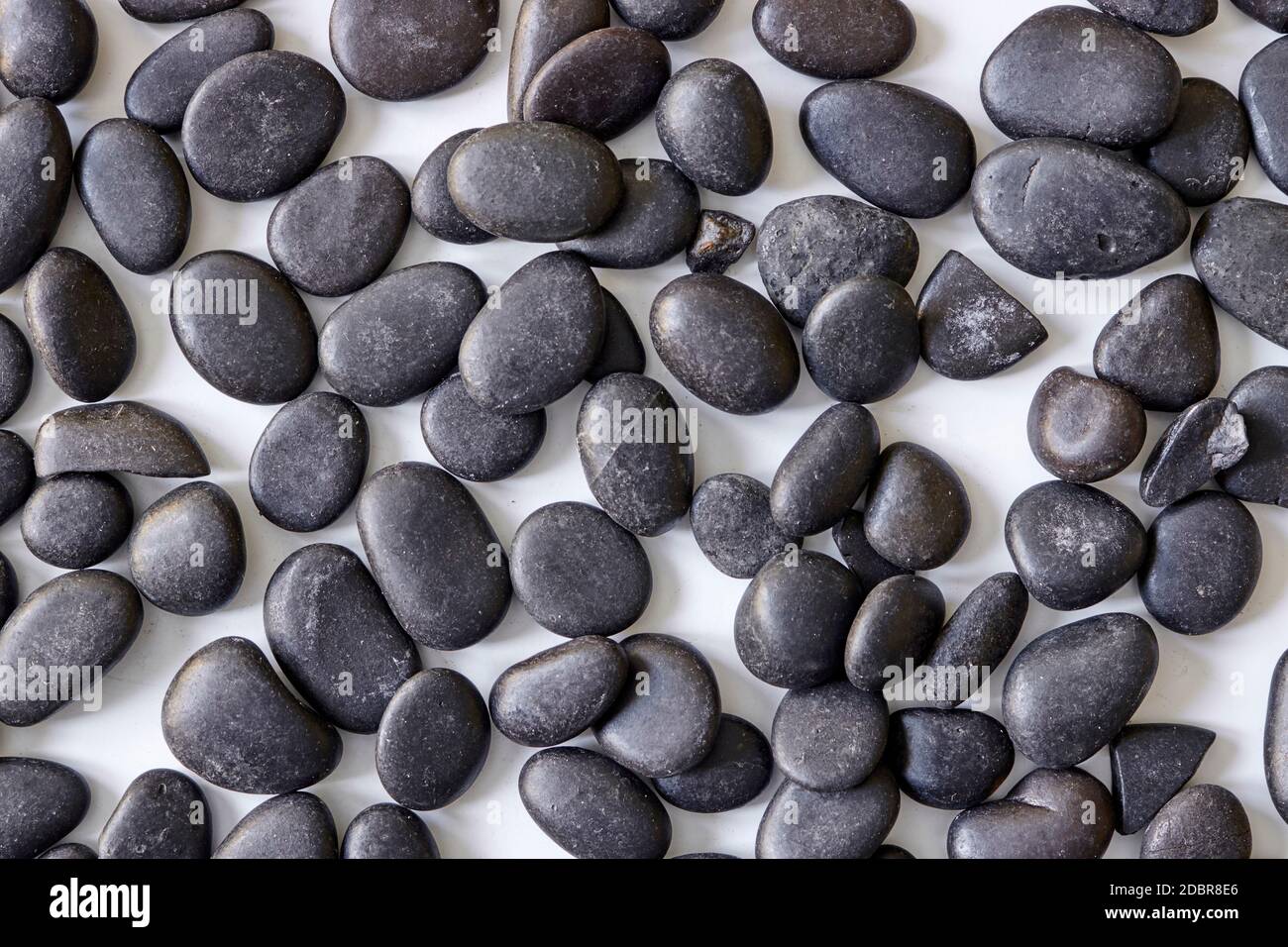 A studio photo of black river rocks Stock Photo - Alamy