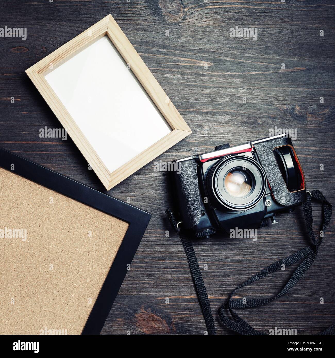 Vintage camera and blank photo frames on wood table background. Flat ...