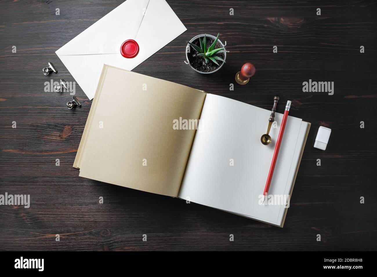 Blank open book and vintage stationery on wood table background. Flat ...
