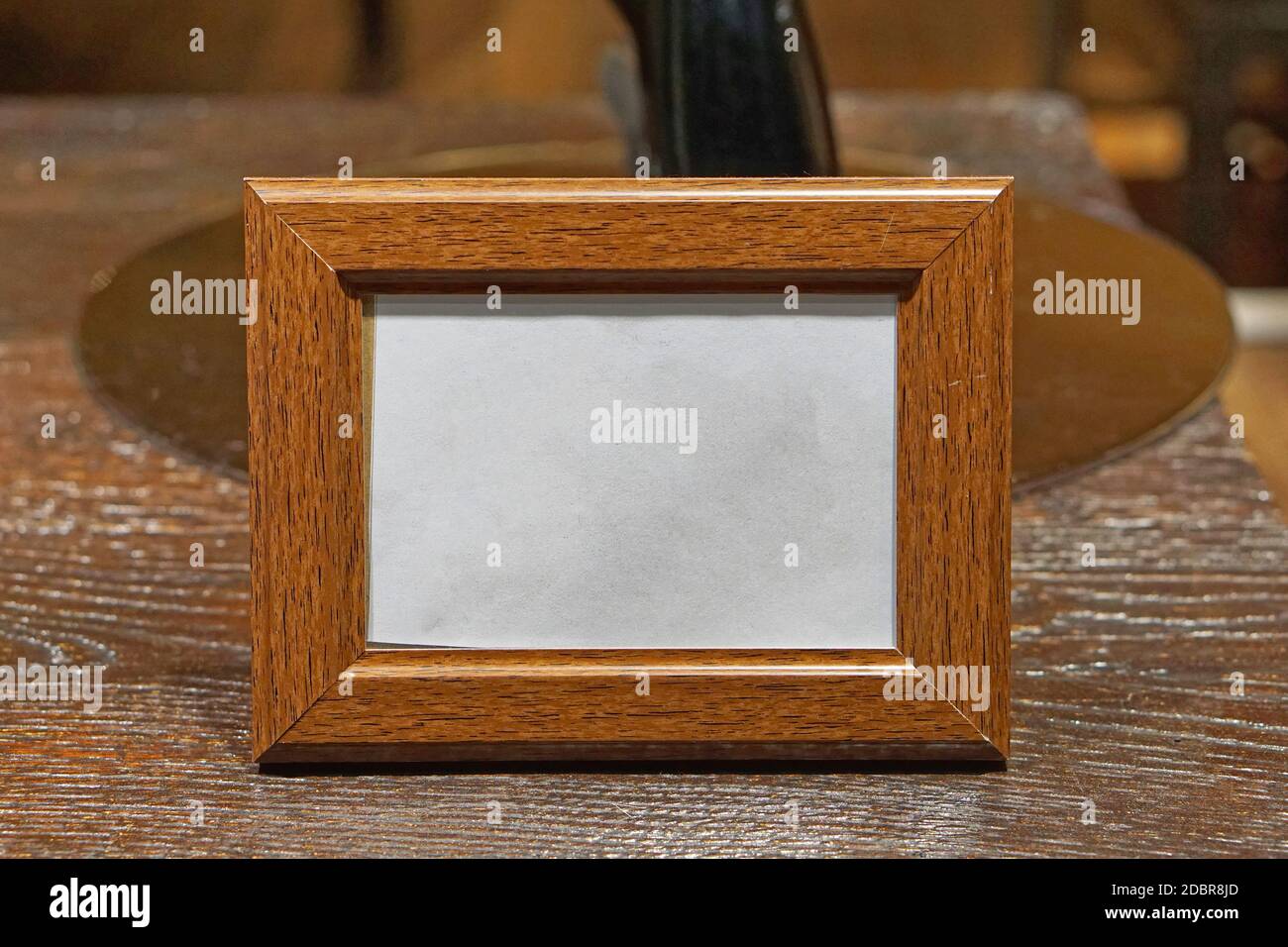 Horizontal empty wooden picture frame at desk Stock Photo - Alamy