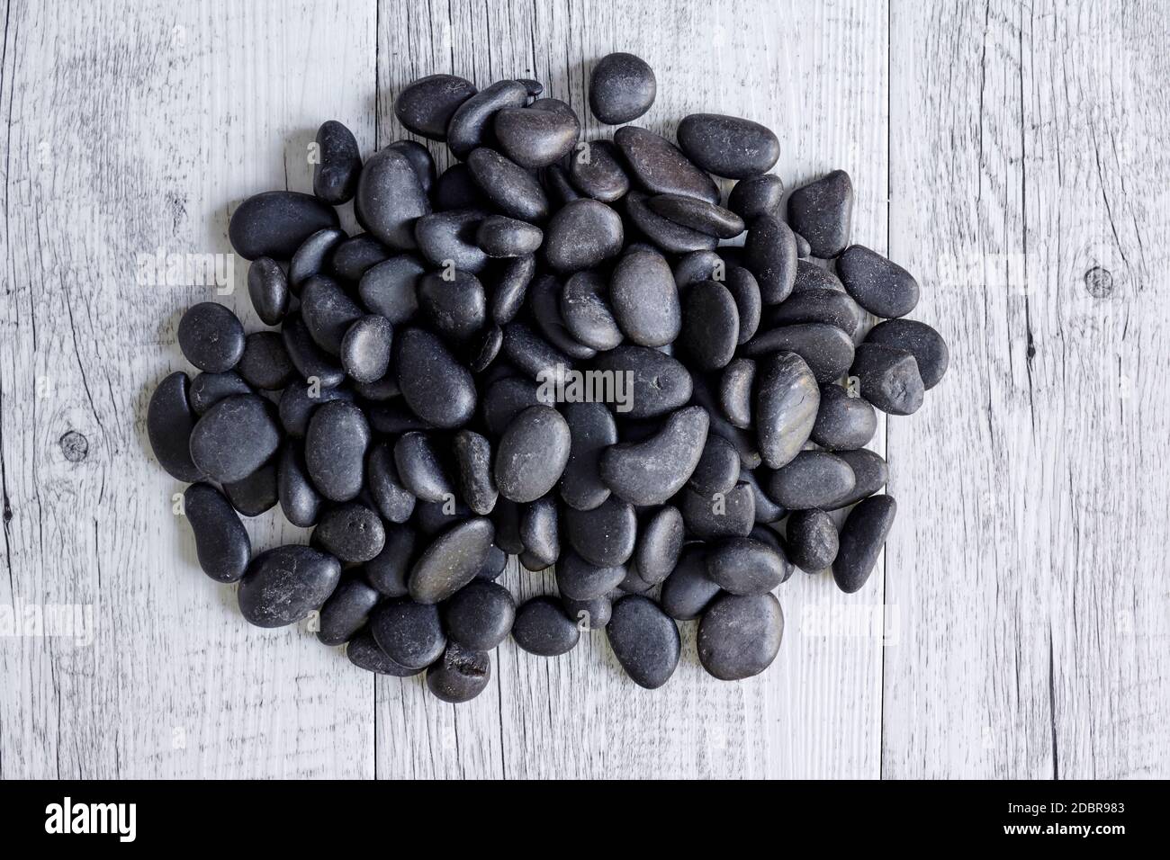 A studio photo of black river rocks Stock Photo - Alamy