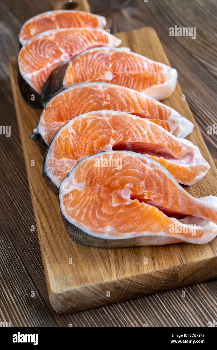 Raw steaks of Arctic char on the wooden board Stock Photo - Alamy