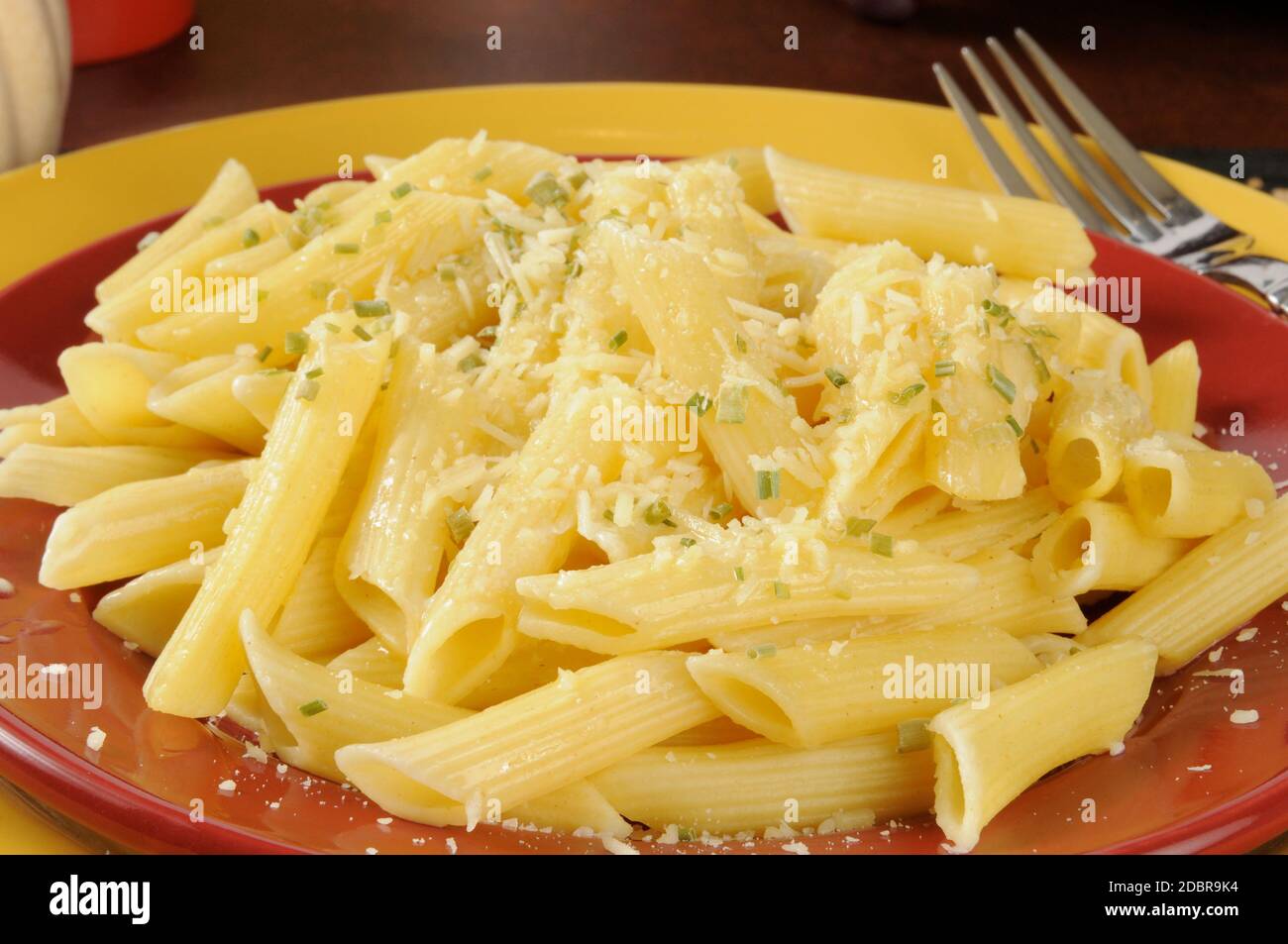 Buttered penne rigate noodles with parmesan and romano cheese Stock ...