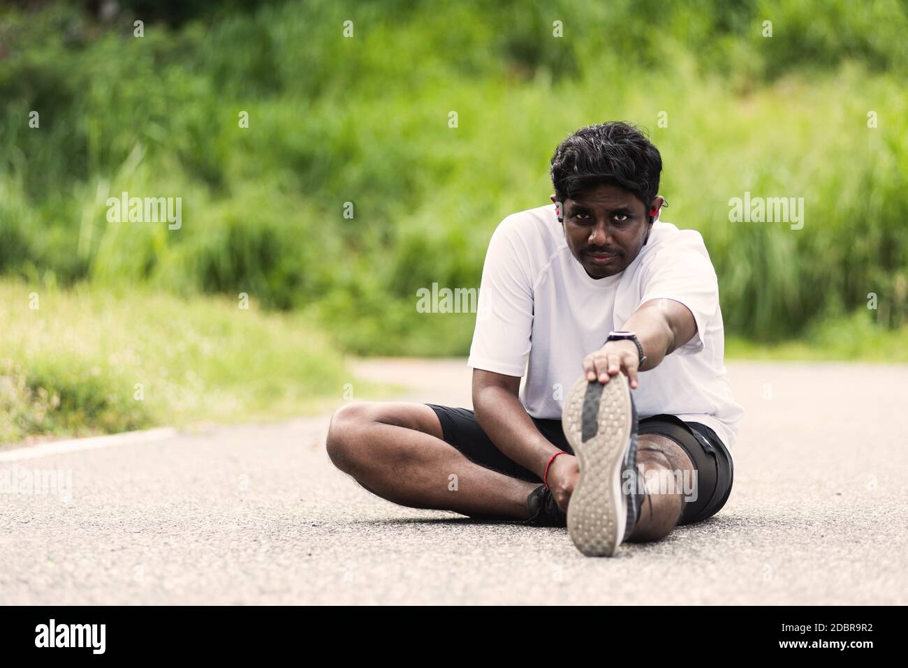 Close up Asian young athlete sport runner black man wear watch he ...