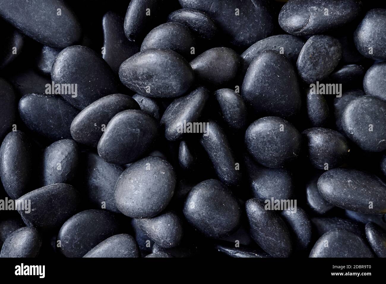 A studio photo of black river rocks Stock Photo - Alamy