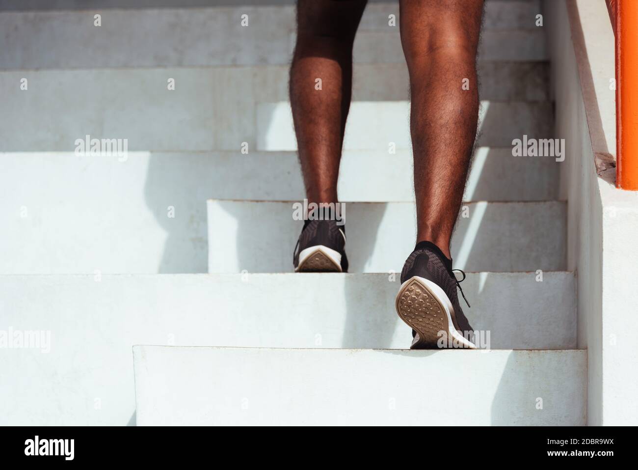 Close up athlete shoes of legs young sport runner black man step ...