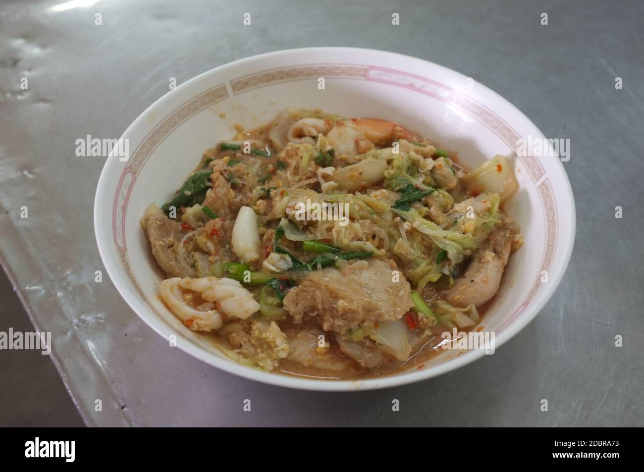 Dry Suki with pork and vegetables (Thai style) served with spicy sauce ...