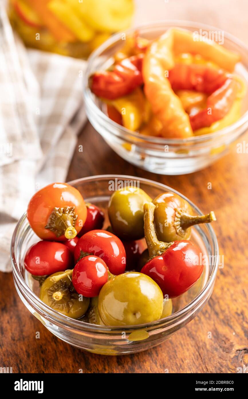 Pickled chili peppers in glass bowl Stock Photo - Alamy