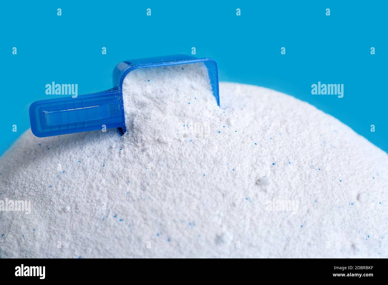 Detergent powder with measuring spoon for clothes washing. Laundry ...