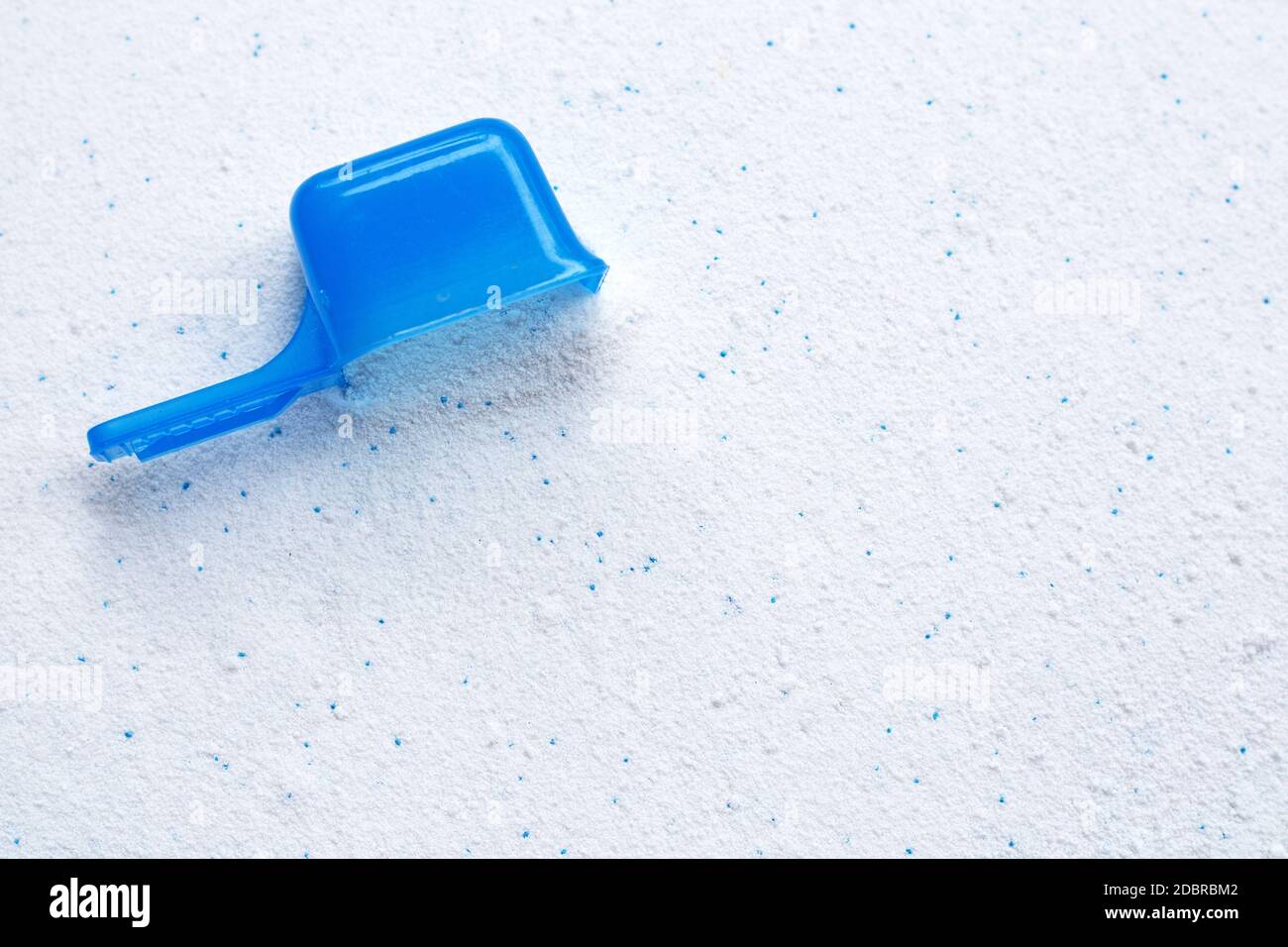 Detergent powder with measuring spoon for clothes washing. Laundry ...