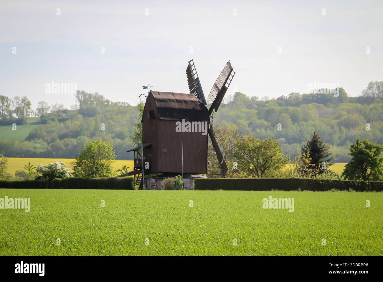 View of a well-preserved old post mill Stock Photo - Alamy