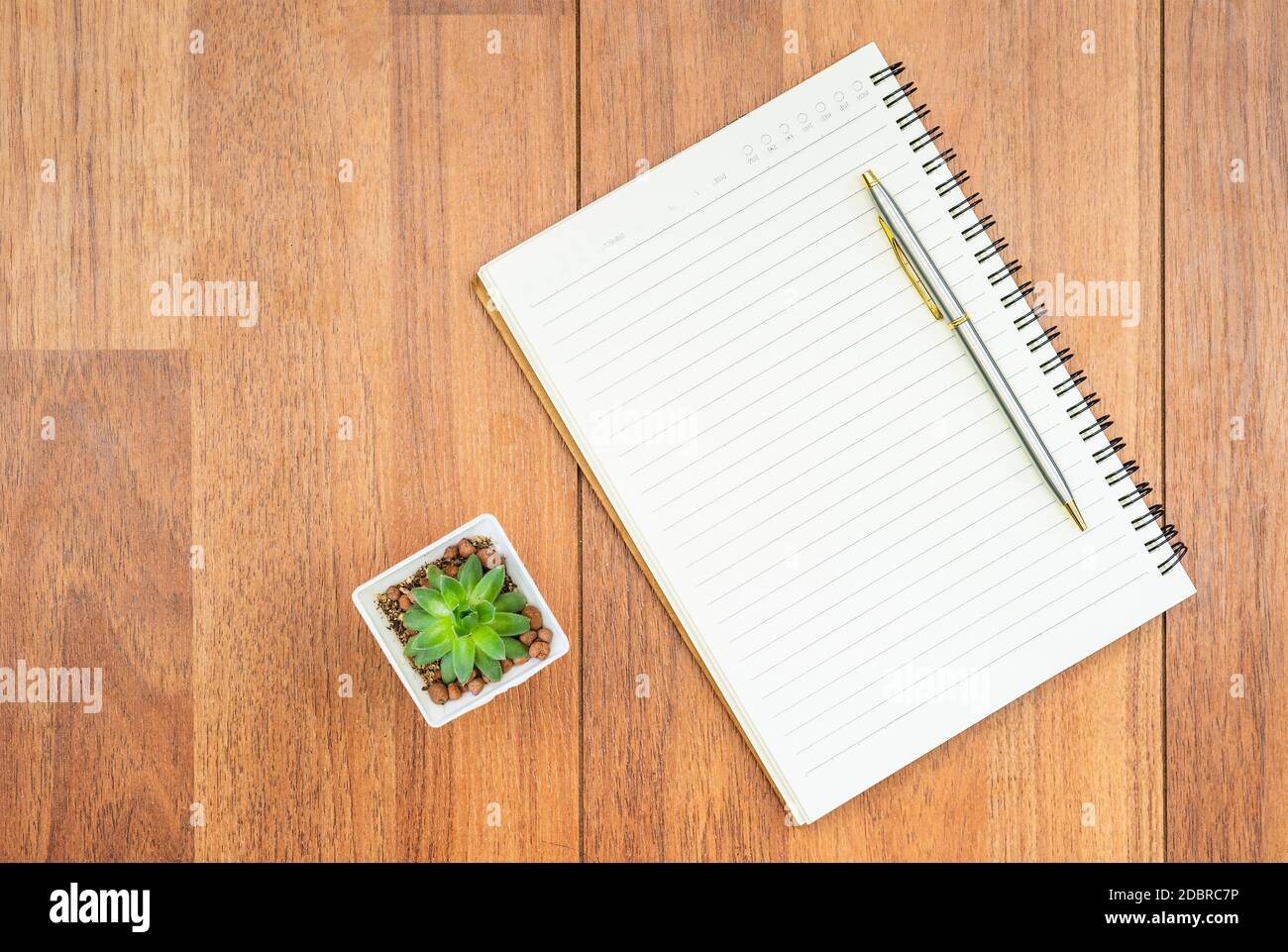 Top view pen and notepad on wood deck with copyspace Stock Photo - Alamy