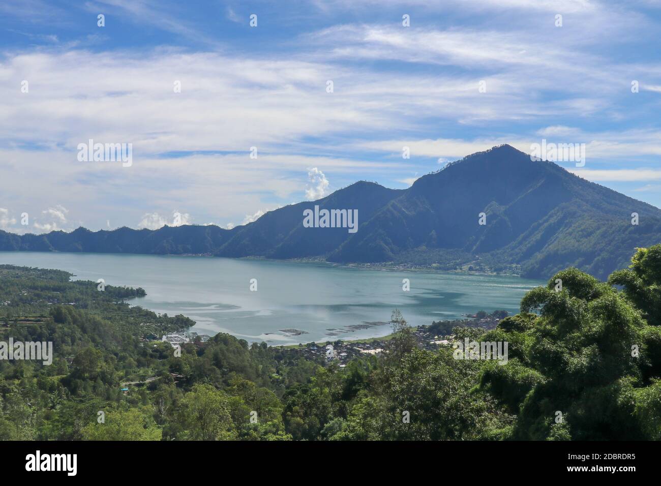 Mountain lake in the volcanic caldera of Batur under Mount Abang on the ...