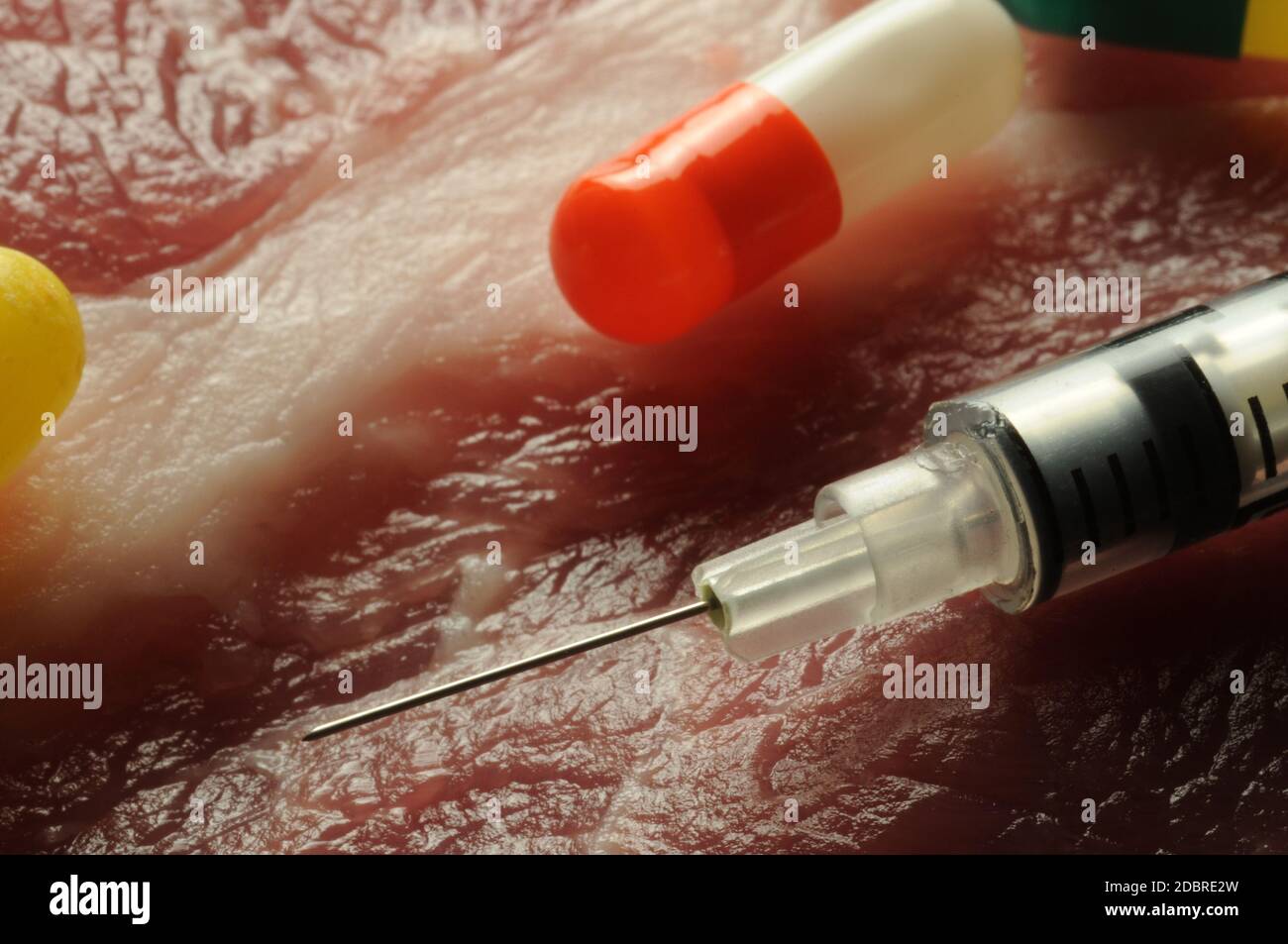Raw steak with pills and syringe Stock Photo - Alamy