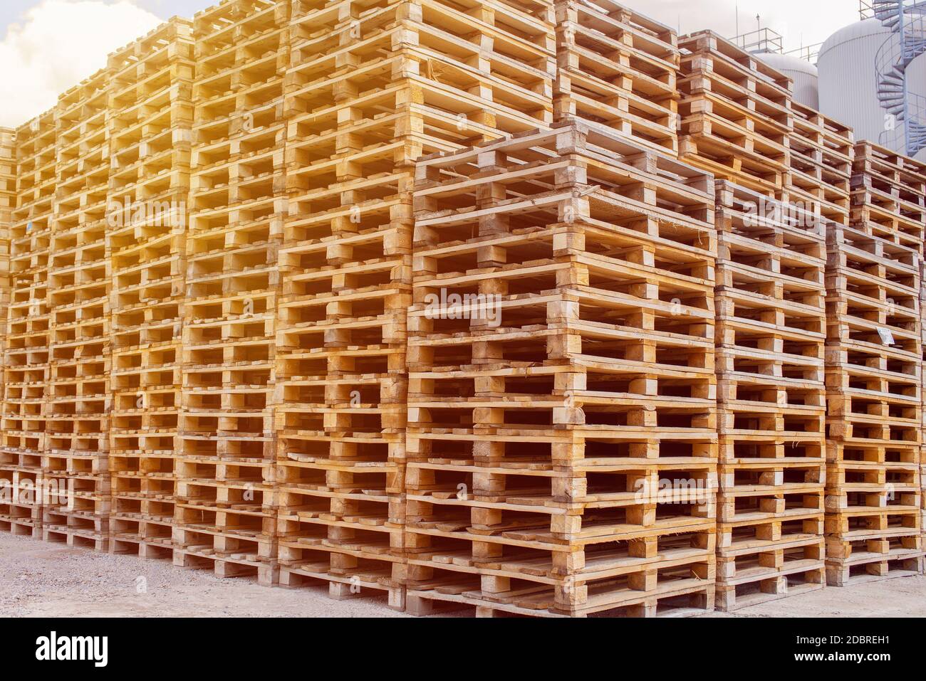 Wooden Euro pallets stacked in big industrial storehouse Stock Photo ...