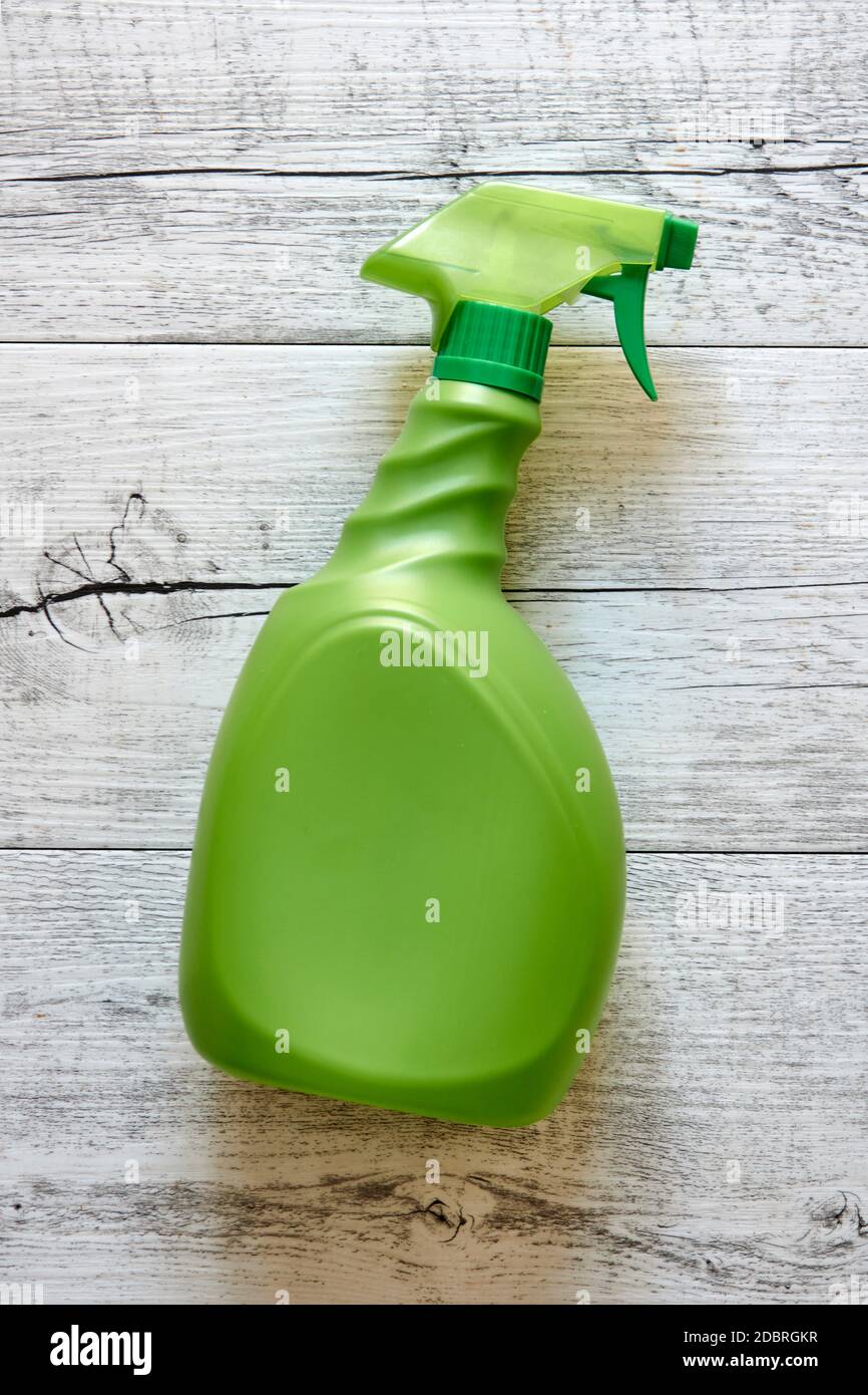 A studio photo of a green spray bottle Stock Photo - Alamy
