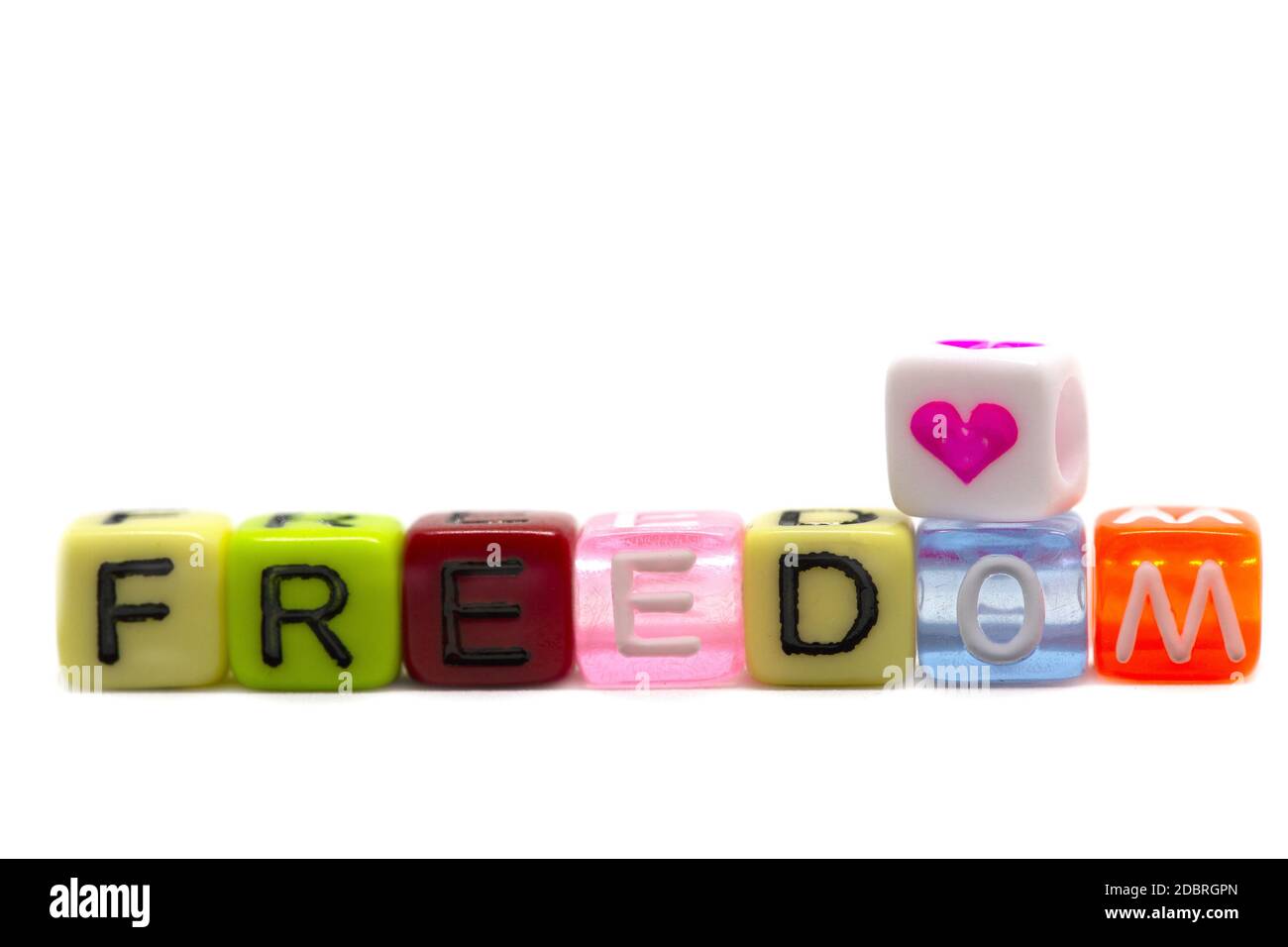 word freedom in rainbow colored cubes isolated on white background ...