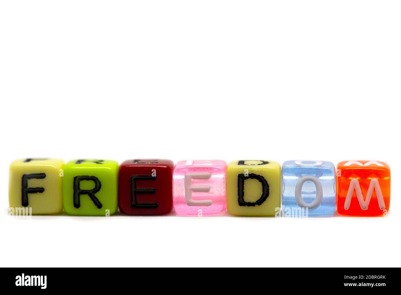 word freedom in rainbow colored cubes isolated on white background ...