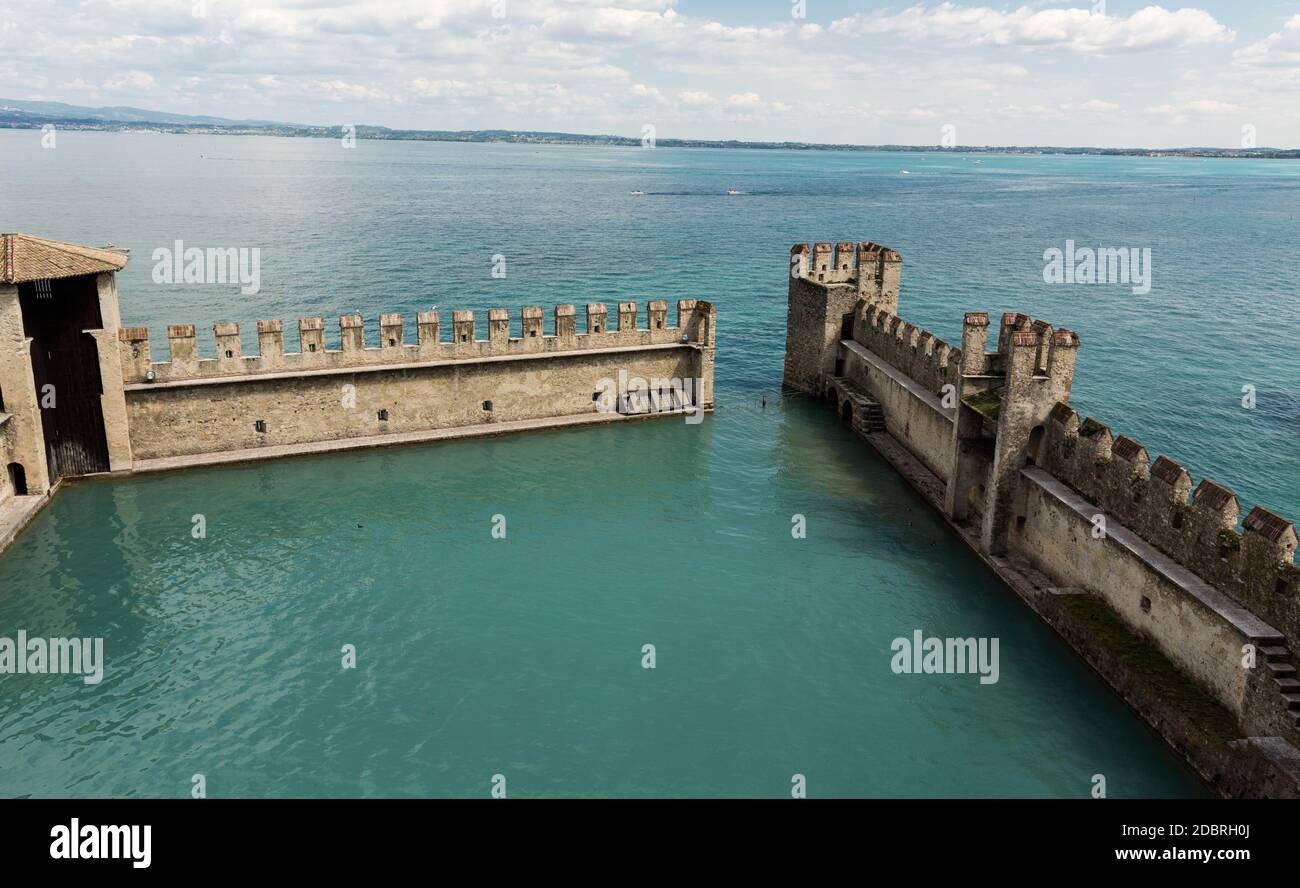 Backwater inside the Scaliger Castle - medieval port fortress, Sirmione ...