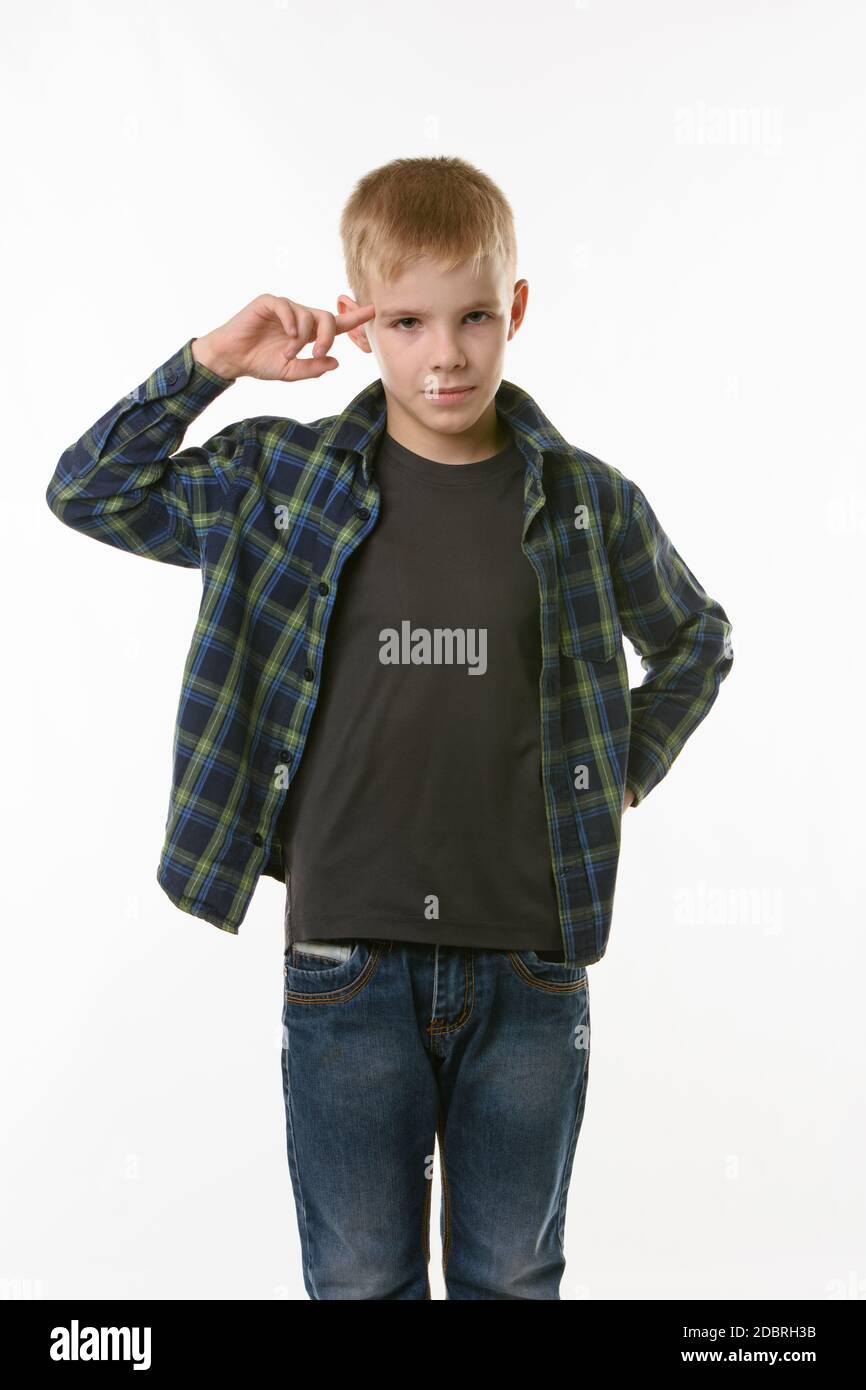 boy put his index finger to the temple on a white background Stock ...