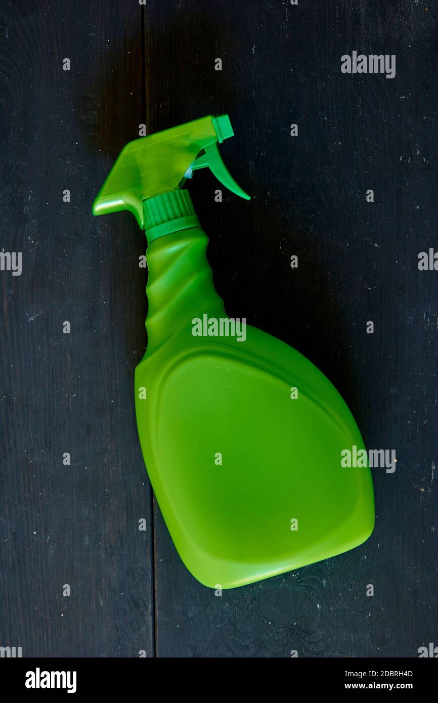 A studio photo of a green spray bottle Stock Photo - Alamy