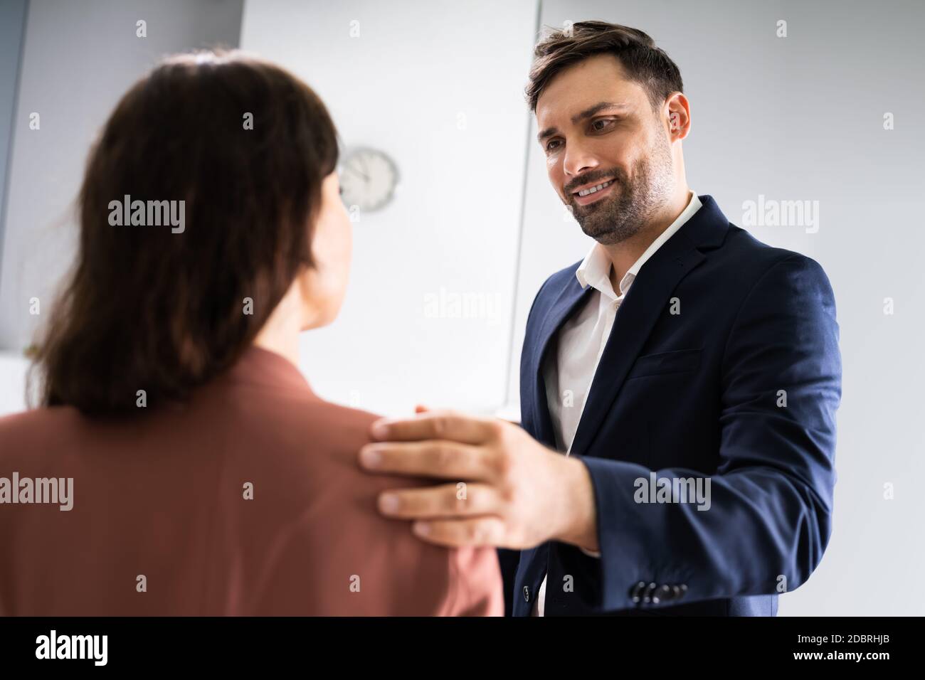 Man hand on womans shoulder hi-res stock photography and images - Alamy