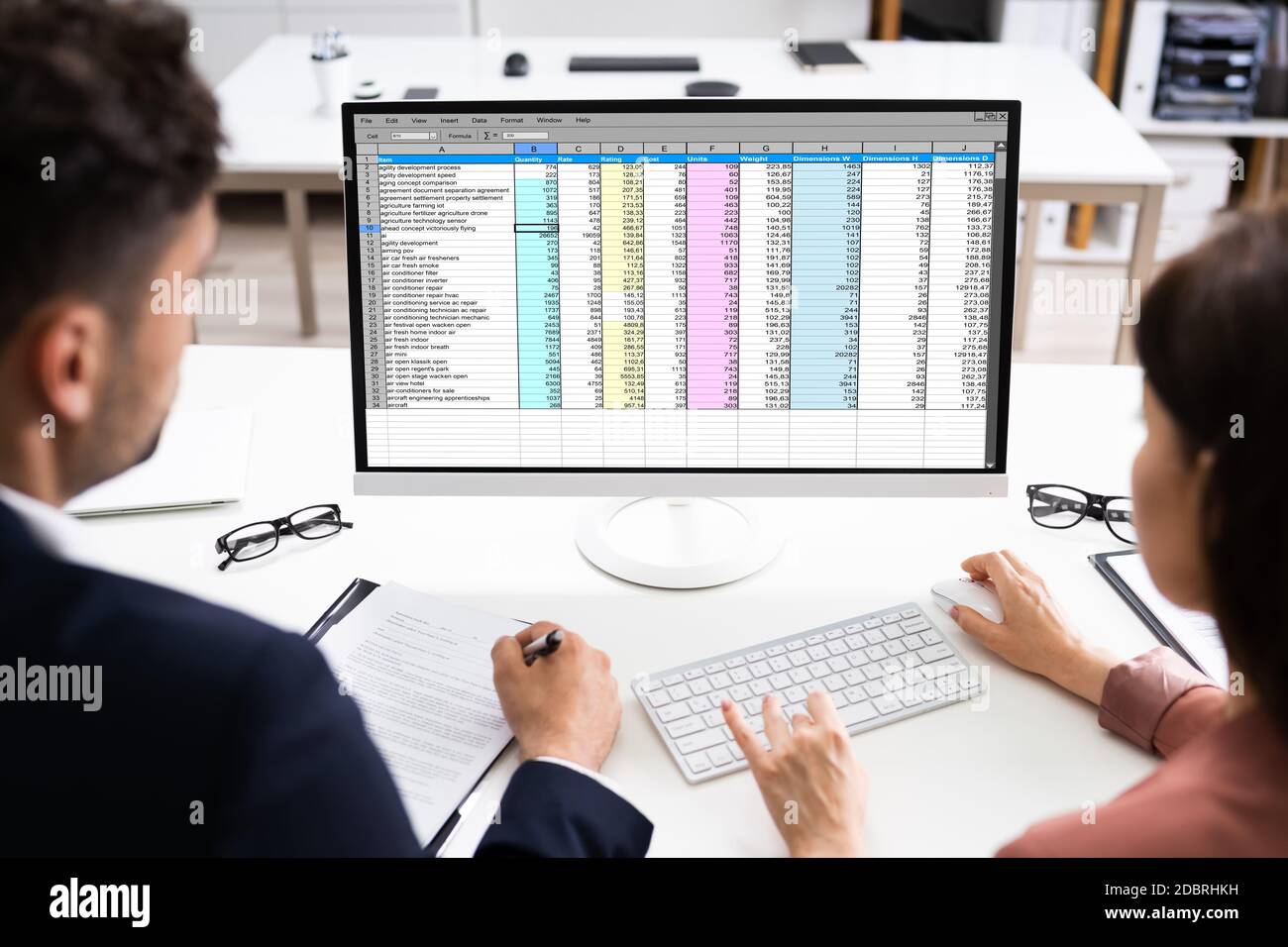 Young Man Working On Spreadsheet High Resolution Stock Photography and ...