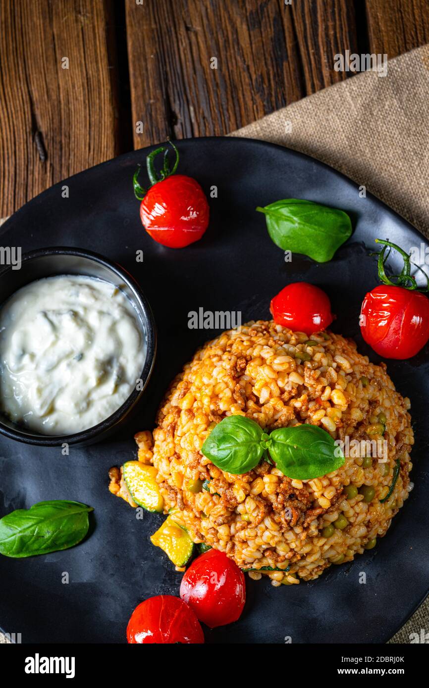 rustic bulgur fried with minced meat and vegetables Stock Photo - Alamy