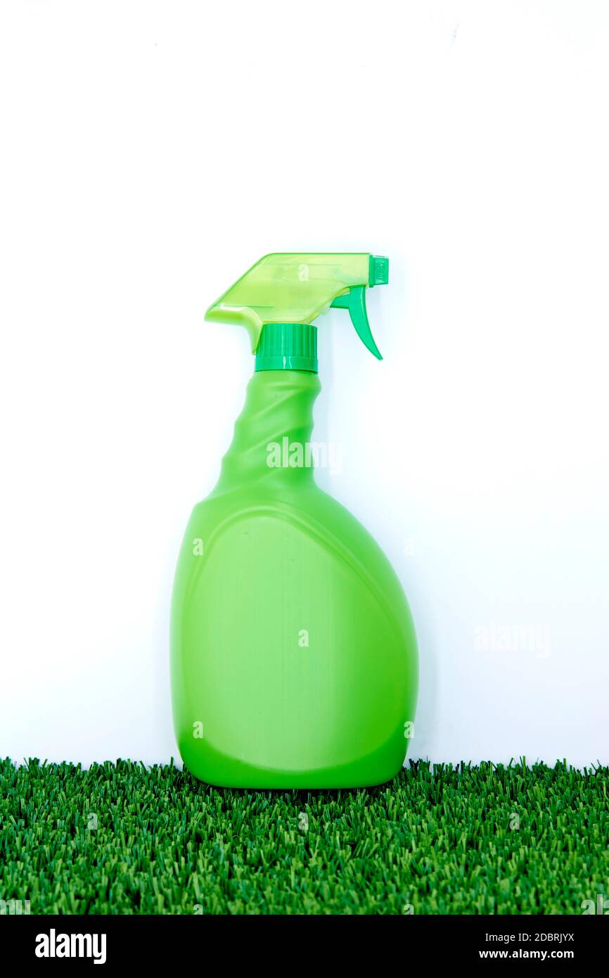A studio photo of a green spray bottle Stock Photo - Alamy