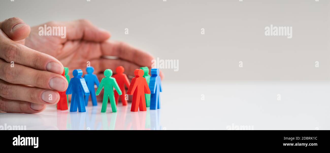 Business Executive Hand Protecting Employee Figures Concept Stock Photo ...