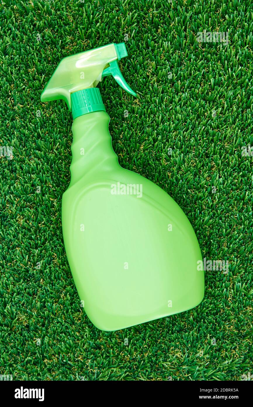 A studio photo of a green spray bottle Stock Photo - Alamy